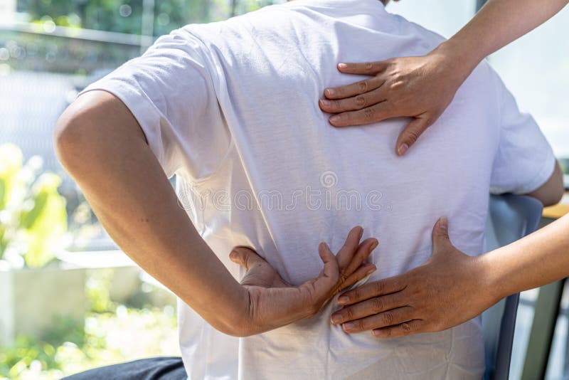 A Physical Therapist is Doing Physical Therapy on a Patient, the ...