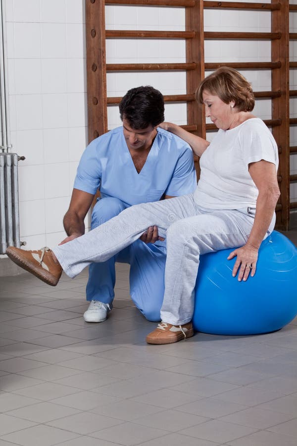 Physical Therapist Helping a Patient Stock Photo - Image of people ...