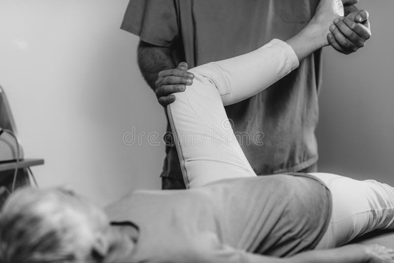 Physical Therapist Working with Leg. Senior Woman Stock Image - Image ...