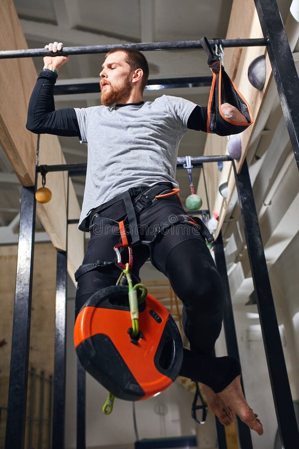 Physically Challenged Young Man Doing Pull Up Exercises with Heavy Load ...