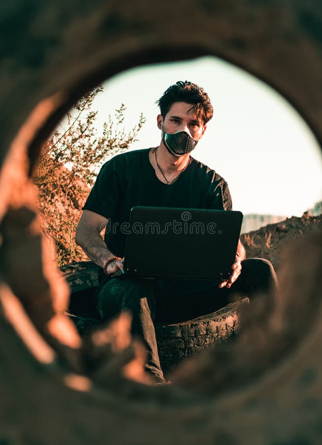 A Physically Distant and Socially Connected Young Man in a Black Outfit ...