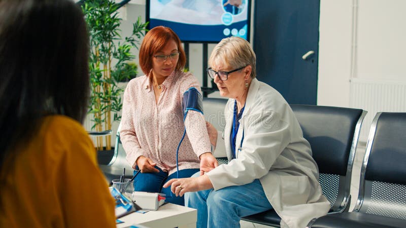 Physician Checking Blood and Pulse Pressure with Tonometer Stock Photo ...
