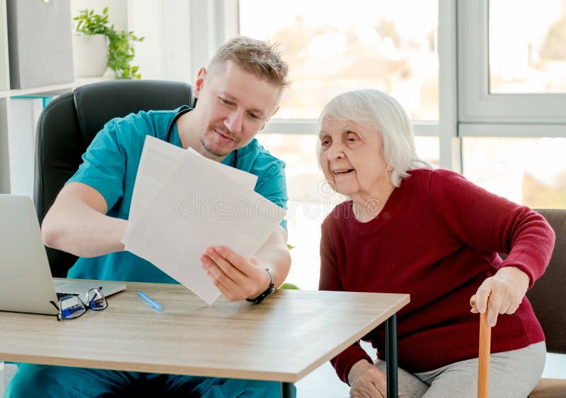 Physician Explaining Treatment To Old Lady Stock Photo - Image of ...