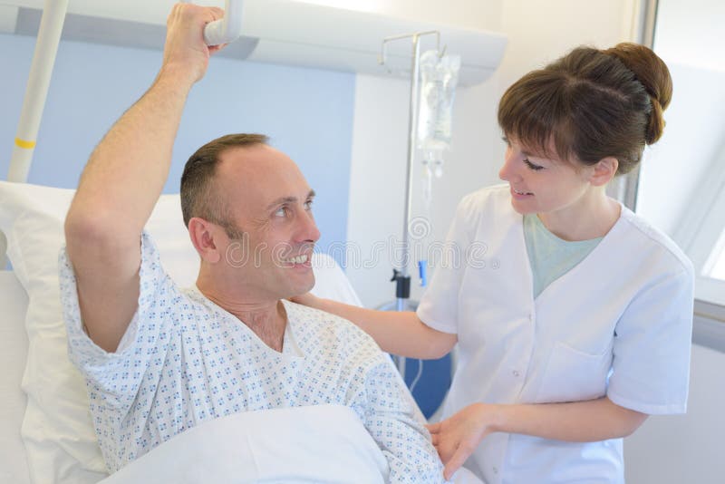Physician with Patient Recovering in Bed Stock Image - Image of male ...