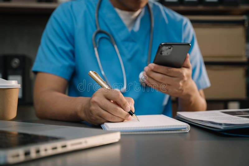 Physician or Practitioner in Room Writing on Blank Notebook and Work on ...