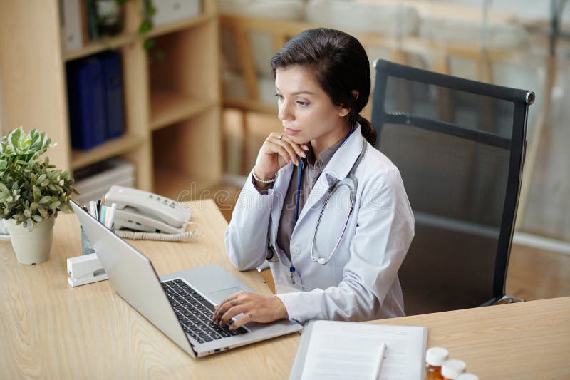Physician Reading Article stock image. Image of healthcare - 270789753