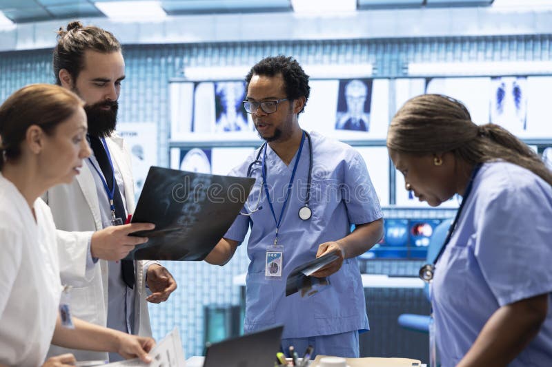 Physicians and Radiologists Examine X Ray Scan Results To Develop ...