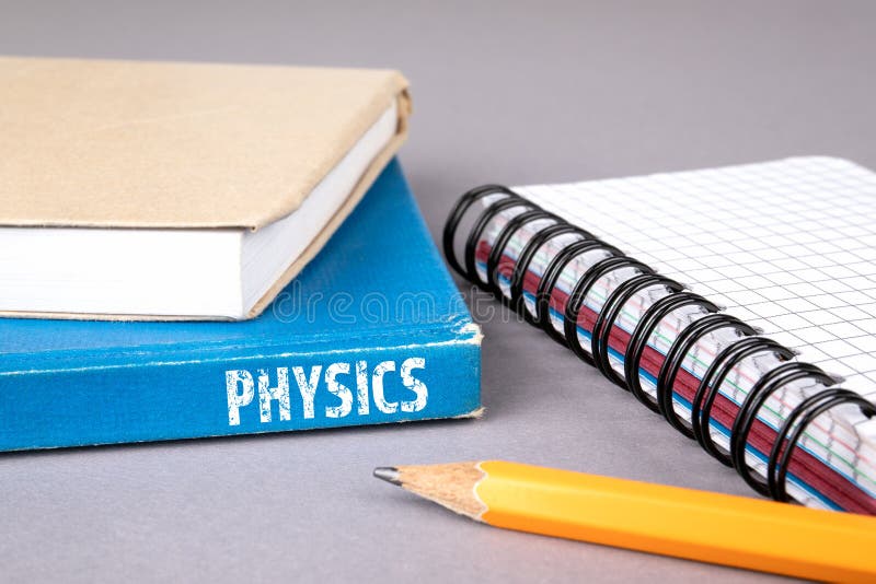Physics Concept. Blue Book on a Gray Office Table Stock Photo - Image ...