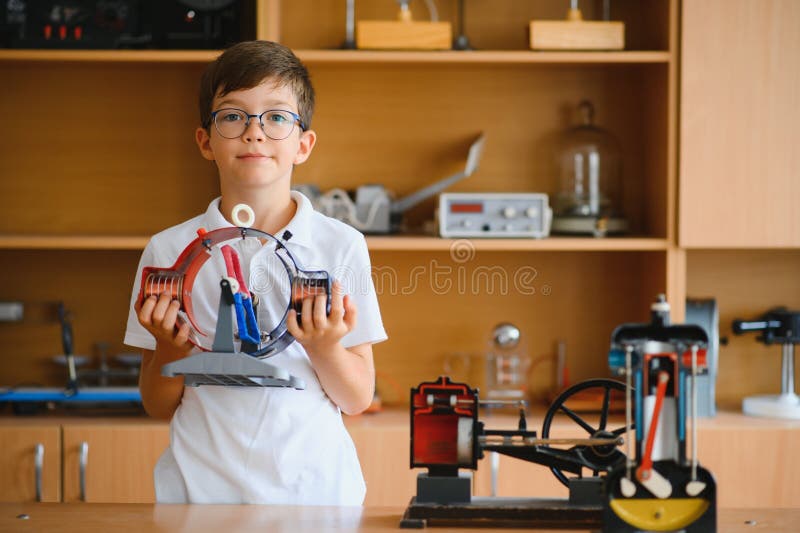 Physics Lesson. a Student at a Desk with Scientific Instruments and a ...