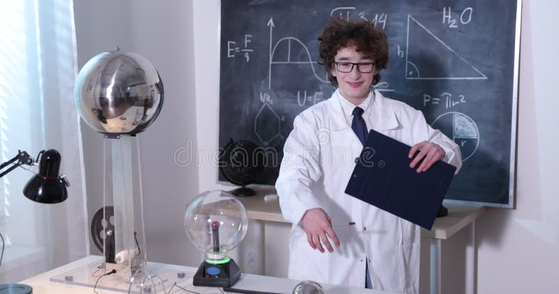 Physics Science Lab: Handsome Young Scientist in White Coat and Glasses ...