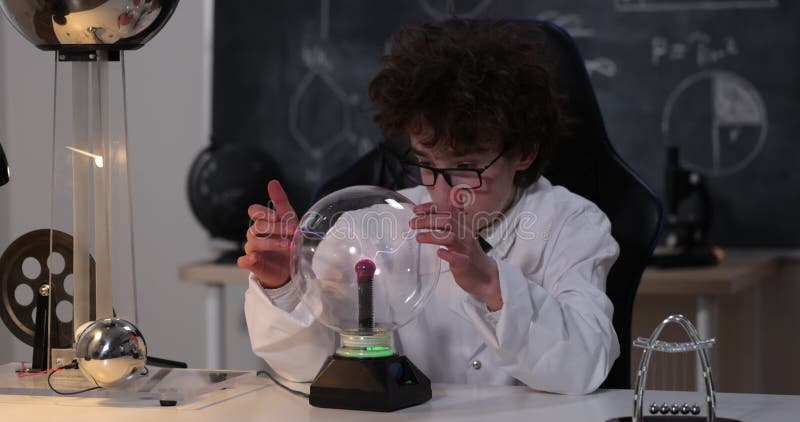 Physics Science Lab: Handsome Young Scientist in White Coat and Glasses ...