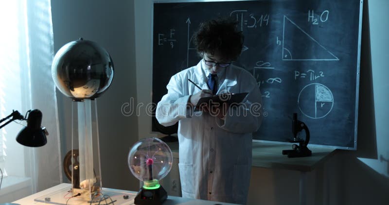 Physics Science Lab: Handsome Young Scientist in White Coat and Glasses ...