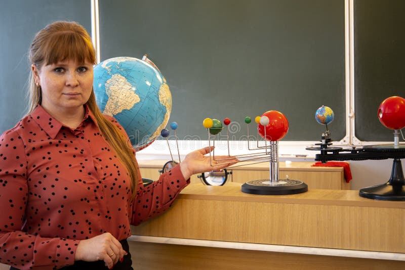 A Physics Teacher Explains the Educational Material. Stock Image ...