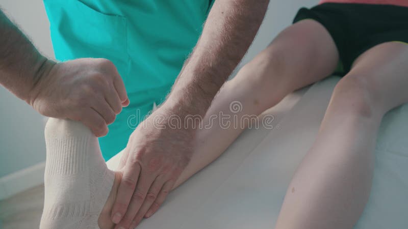 A Physio Gives Myotherapy Using Trigger Points on Athlete Woman Stock ...