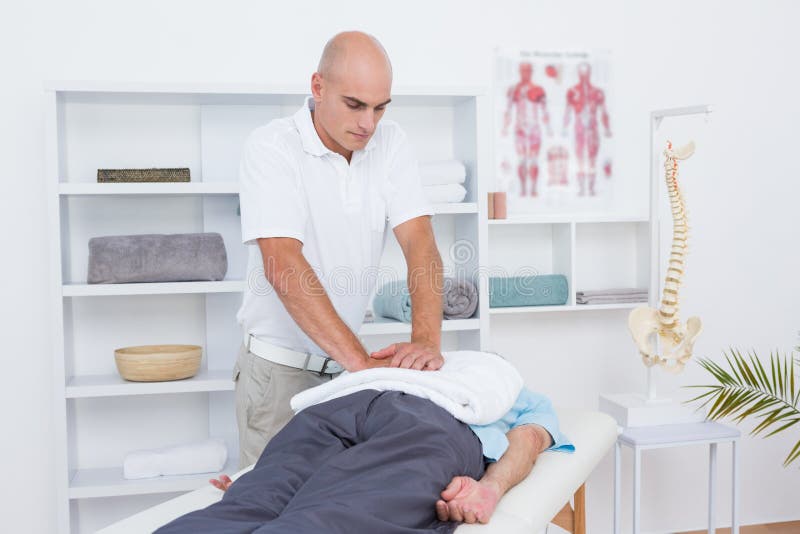 Physiotherapist Doing Back Massage Stock Photo - Image of checking ...