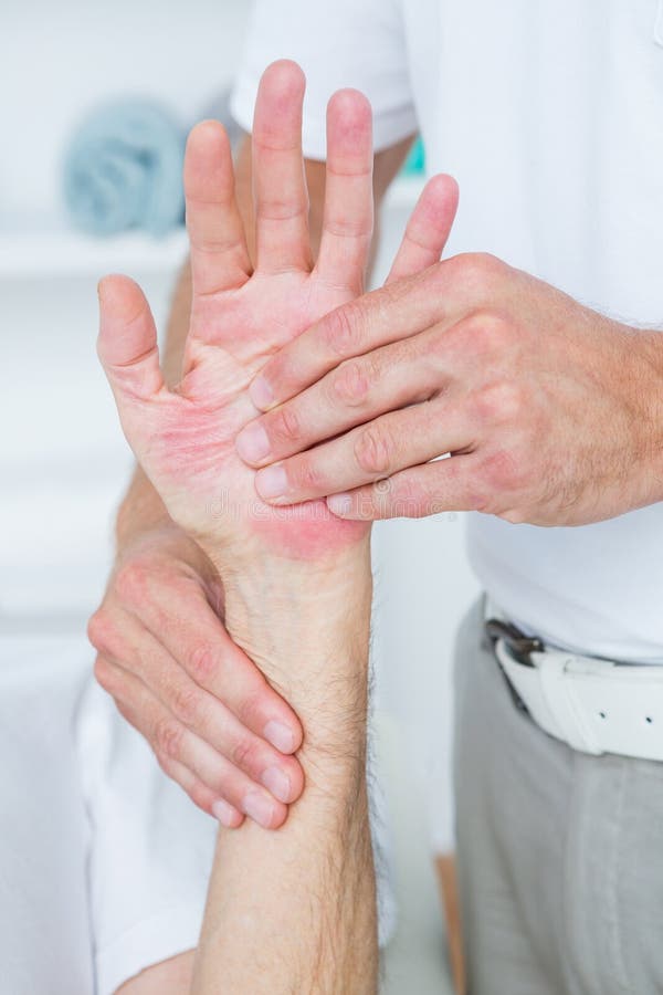 Physiotherapist Doing Hand Massage Stock Photo - Image of checking ...