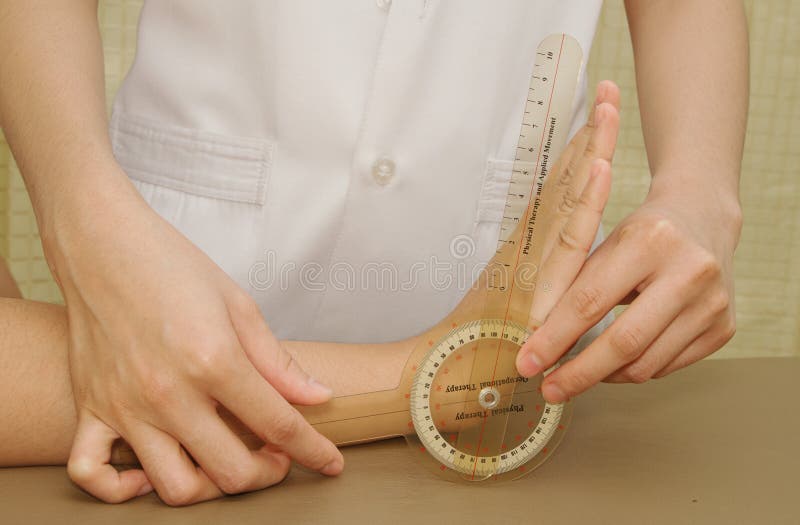 Physiotherapist Exam Patients Wrist With Goniometer Stock Photo - Image ...
