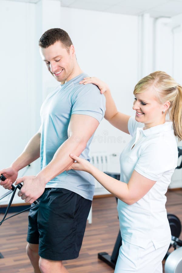 Physiotherapist Excercising Patient in Practice Stock Image - Image of ...
