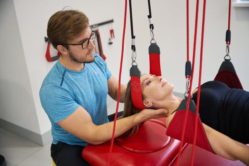 Physiotherapist Fixes a Woman in Suspended Loop System on Redcord Stock ...