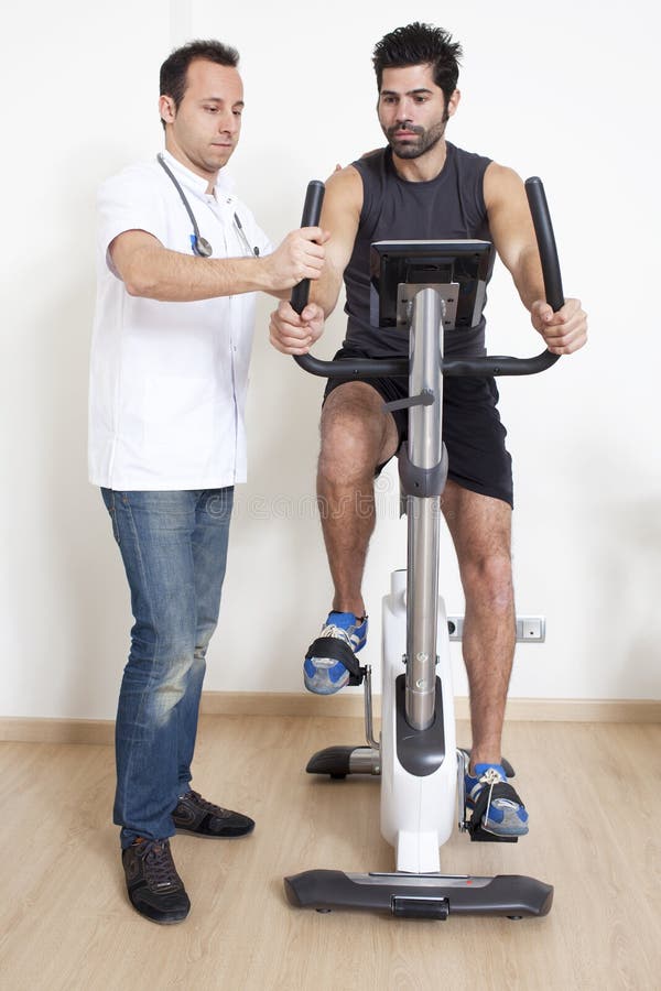Physiotherapist Helping Patient with Exercise Stock Image - Image of ...