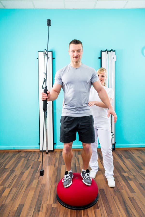 Physiotherapist Working with Patient in Practice Stock Image - Image of ...