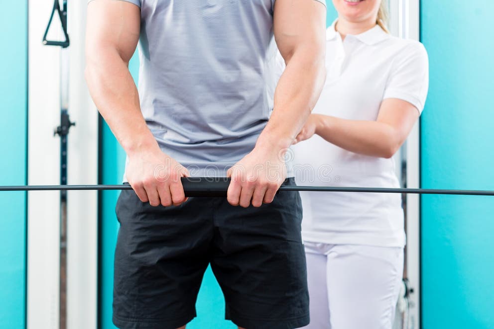Physiotherapist Working with Patient in Practice Stock Photo - Image of ...