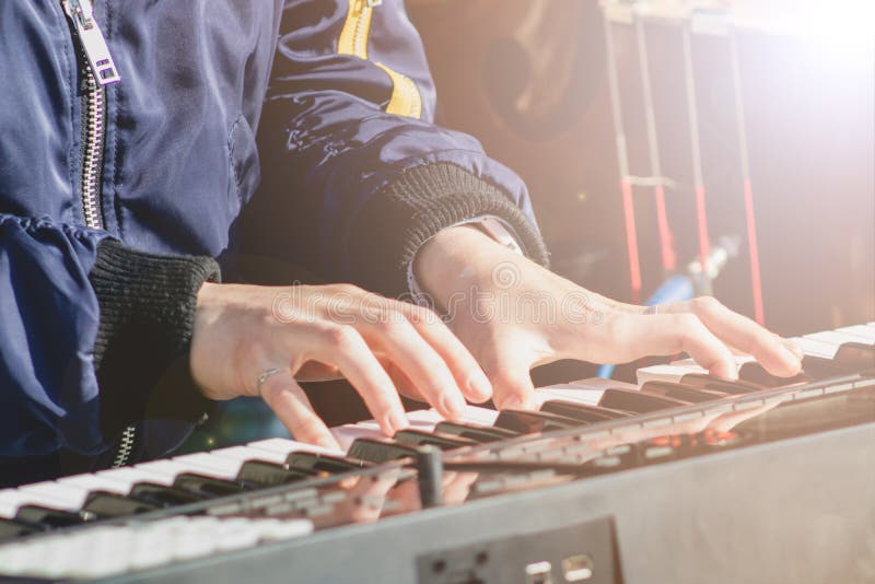 Pianist Play the Keys of the Electronic Synth at the Outdoor ...