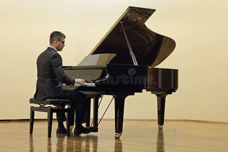 Pianist Playing on Black Grand Piano Stock Photo - Image of library ...