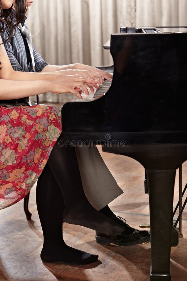 Piano duet stock image. Image of artist, male, female - 30626079