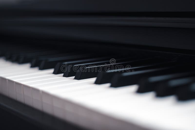 Piano and Electronic Piano Keyboard with Black Backgrounds. Closeup of ...