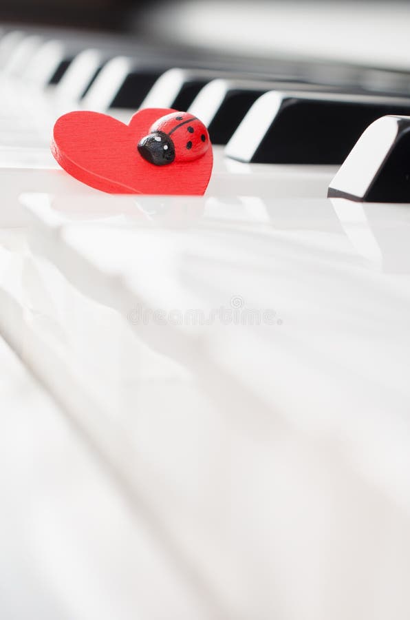 Piano Keyboard with Red Ladybug Ornament - Side View Stock Photo ...