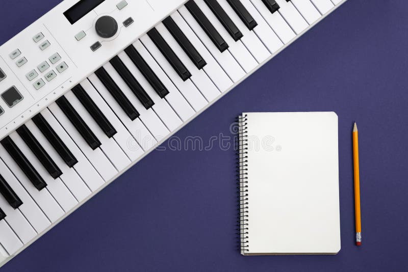 Piano Keys and Blank Notepad on Purple Background, Flat Lay. Stock ...