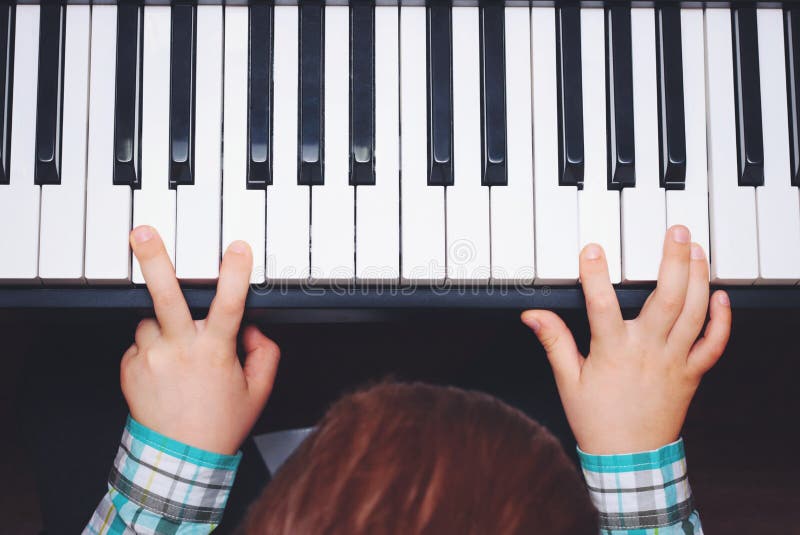 Piano Keys. Boy Receives Piano Lessons Stock Image - Image of ...