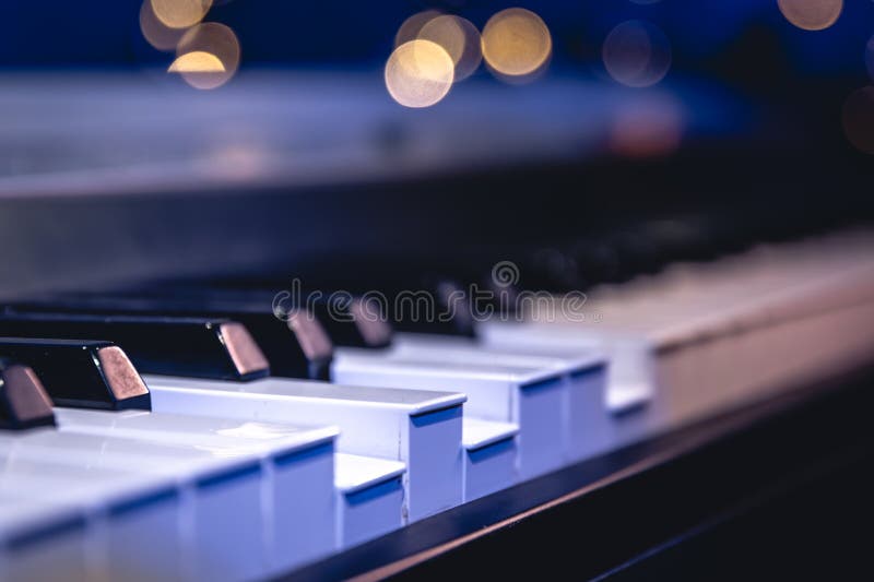 Piano Keys Close-up on a Blurred Background with Bokeh. Stock Photo ...