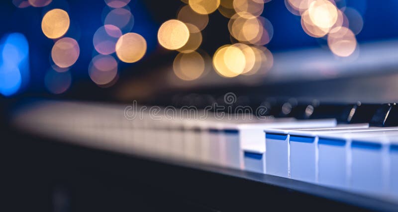 Piano Keys Close-up on a Blurred Background with Bokeh. Stock Image ...