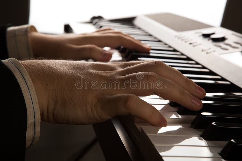 Piano keys and human hands stock photo. Image of white - 37475444