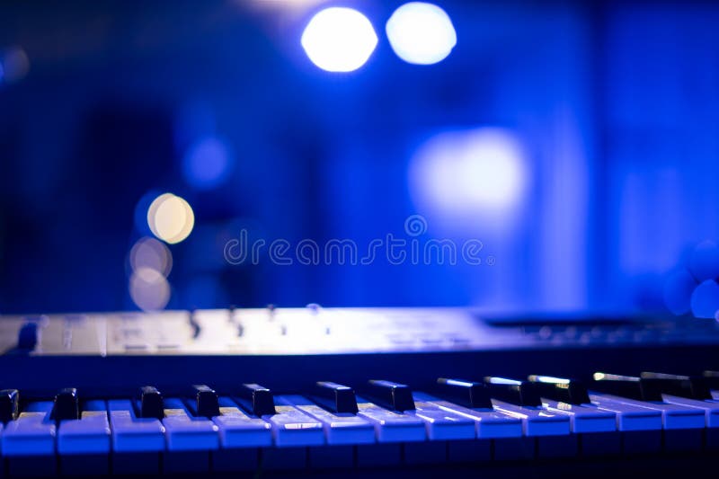 Piano Musical Keyboard on Stage with Blue Lights Stock Image - Image of ...