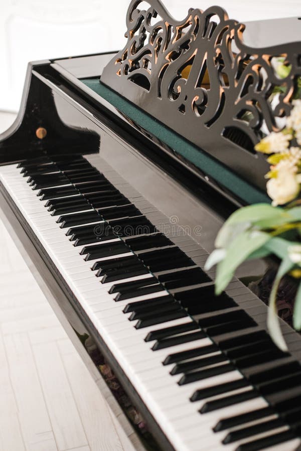 Piano with Open Keys Decorated with a Bouquet of White Roses Stock ...