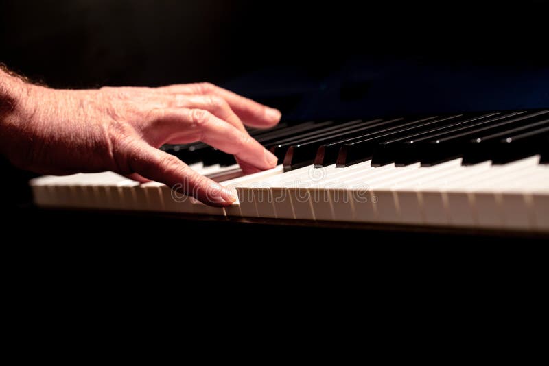 Piano playing keyboard stock photo. Image of hand, white - 135100202