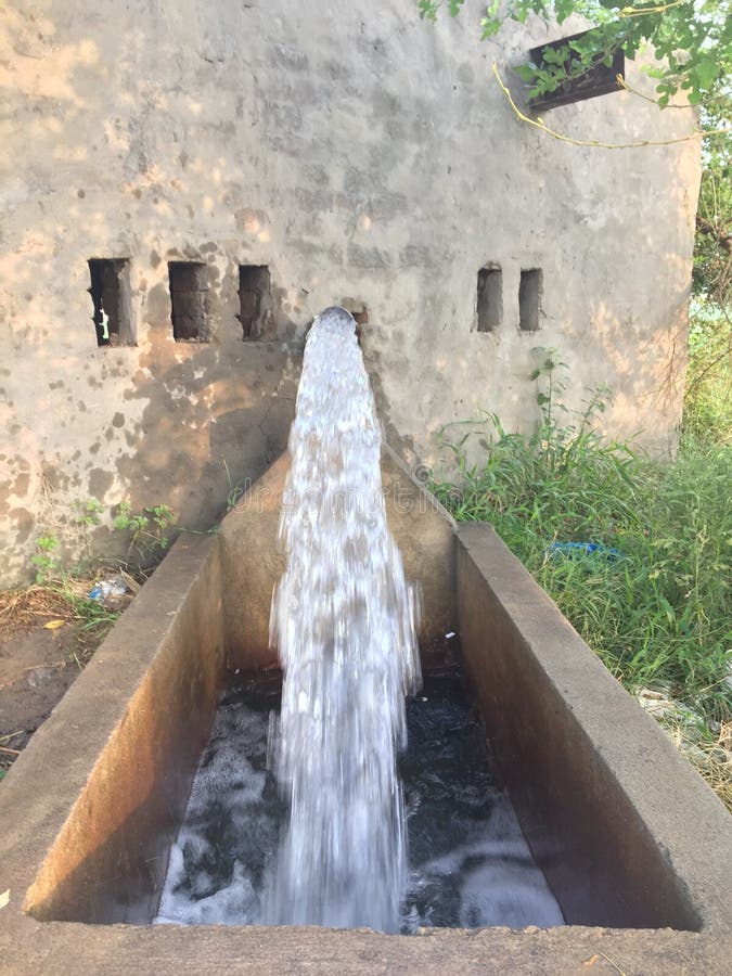 A Tube Well Filling A Canal Stock Image - Image of rocks, fields: 22007383