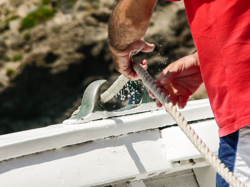 Sailor pick up anchor stock photo. Image of ocean, lift - 48826932