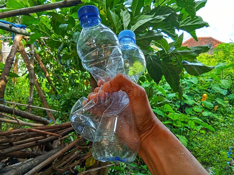 Pick Up Plastic Bottles in the Yard Stock Image - Image of bottle ...