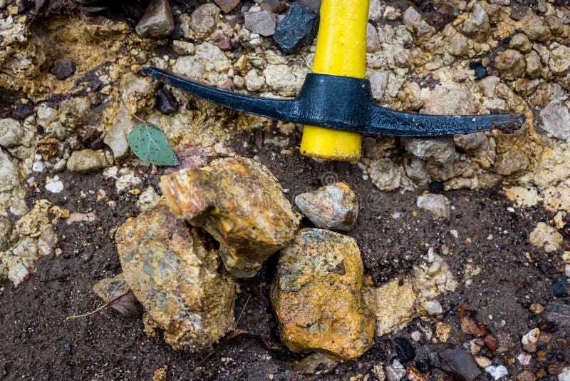 Pickaxe and Rough Stones Collected for the Collection Stock Photo ...