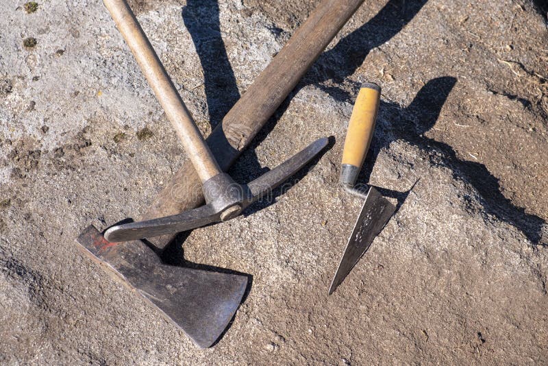 Pickaxe, Trowel and Axe, Tools in an Archaeological Excavation Stock ...