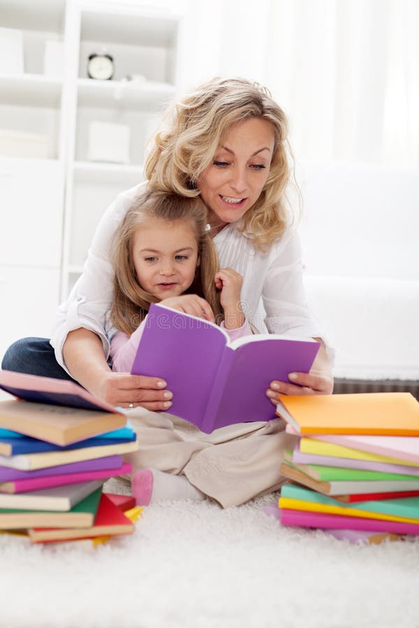 Picking a Story To Read with Mom Stock Photo - Image of lying, adorable ...