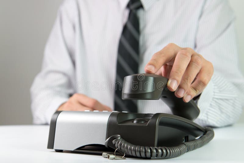 Picking Up a Call in a Black Phone Stock Photo - Image of help, handset ...