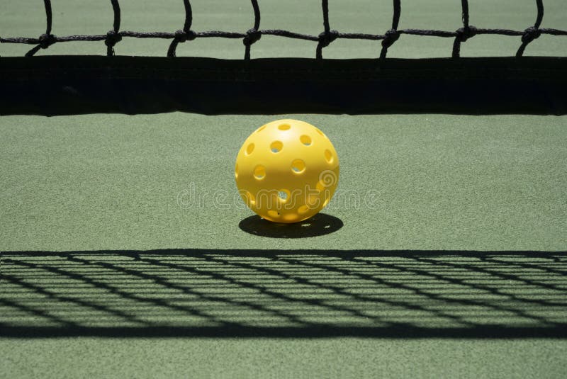 Pickleball on Court Near Net with Shadows Stock Photo - Image of ...
