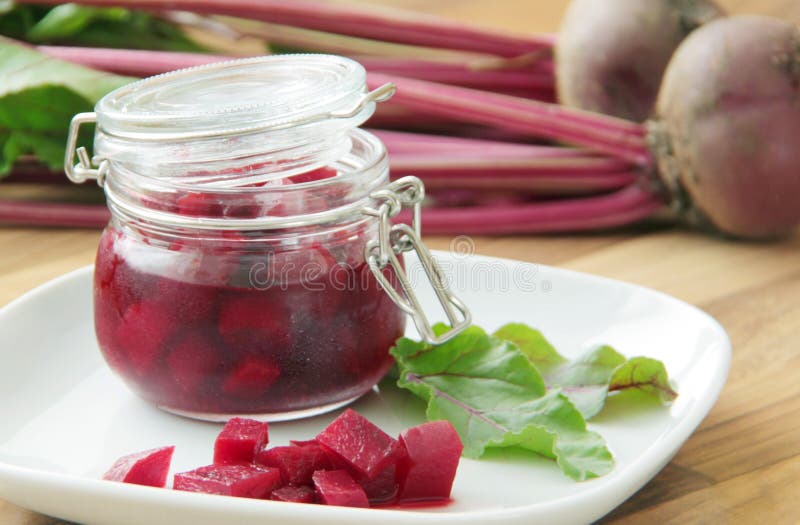 Pickled Beetroot in a Glass Jar. Fresh Beetroots on Background. Close ...