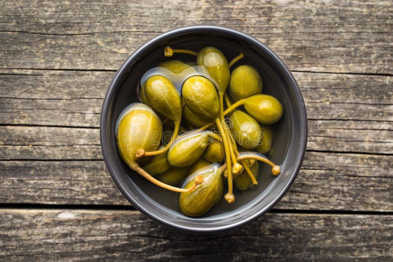 Pickled caper berries. stock image. Image of flavoring - 100292707