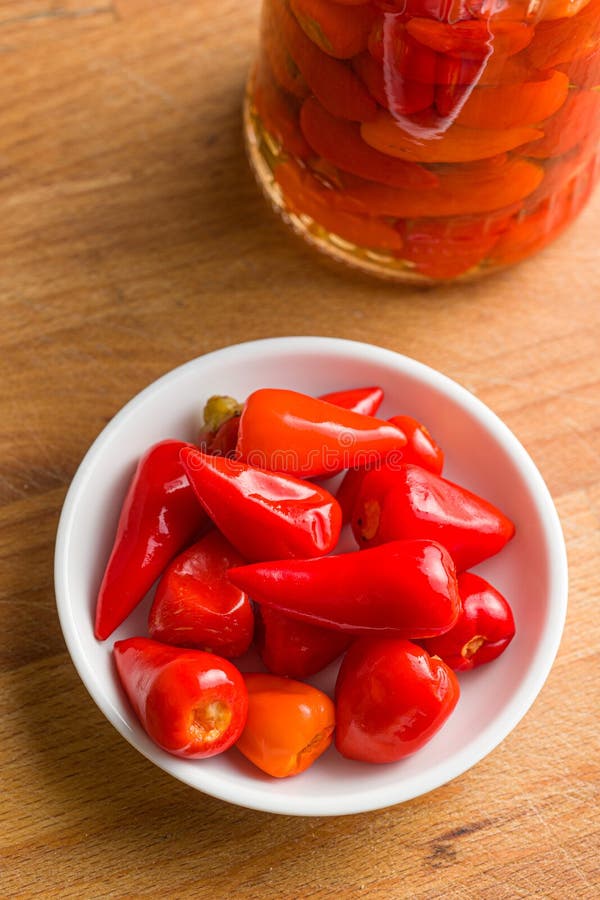 Pickled chili peppers stock image. Image of gourmet - 149655761